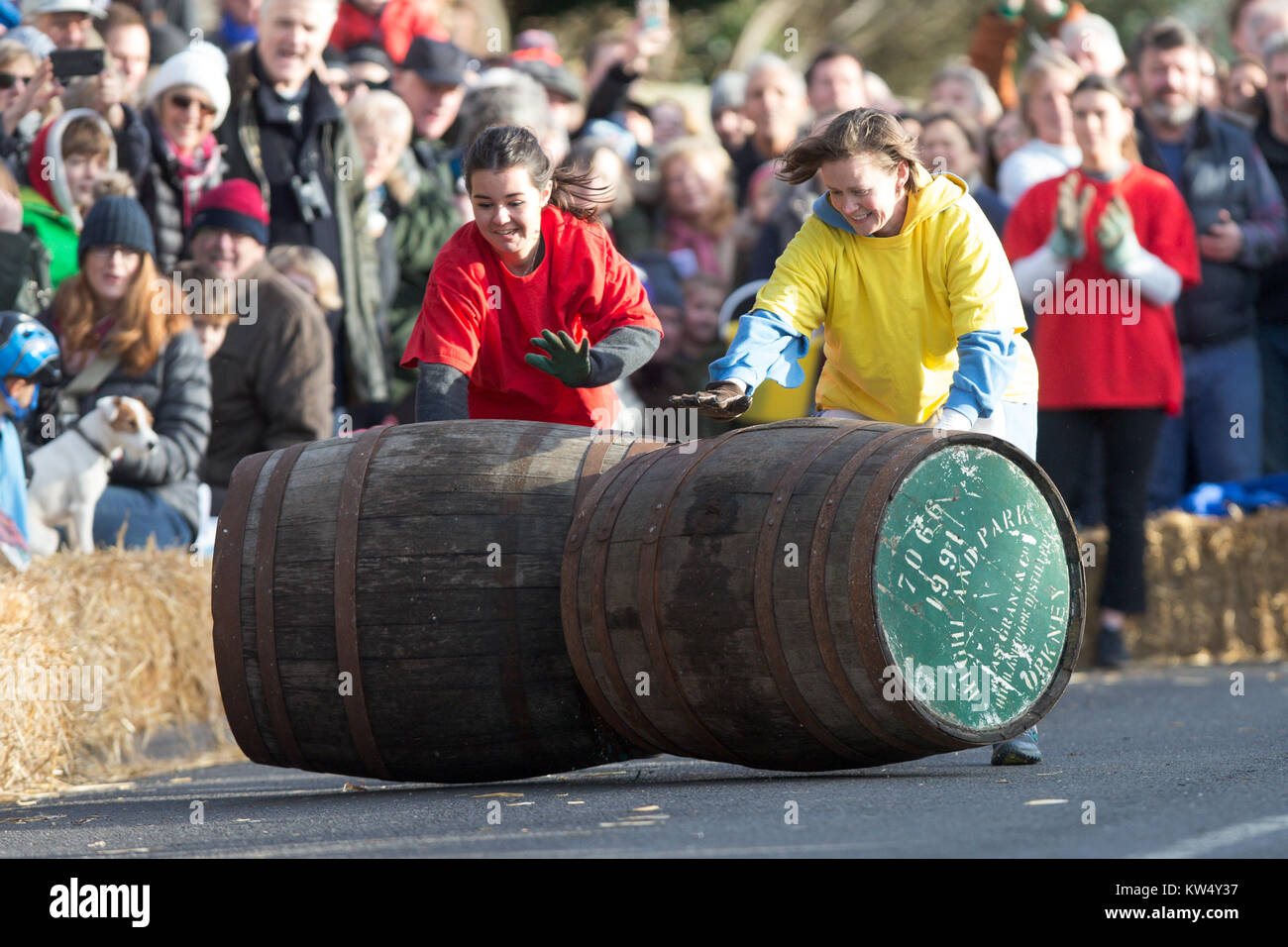 Picture shows competitors trying to control their barrel in the annual ...