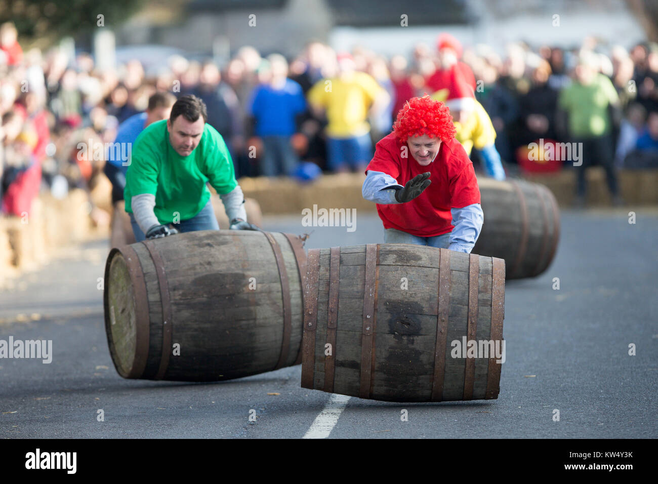 Picture shows competitors trying to control their barrel in the annual ...