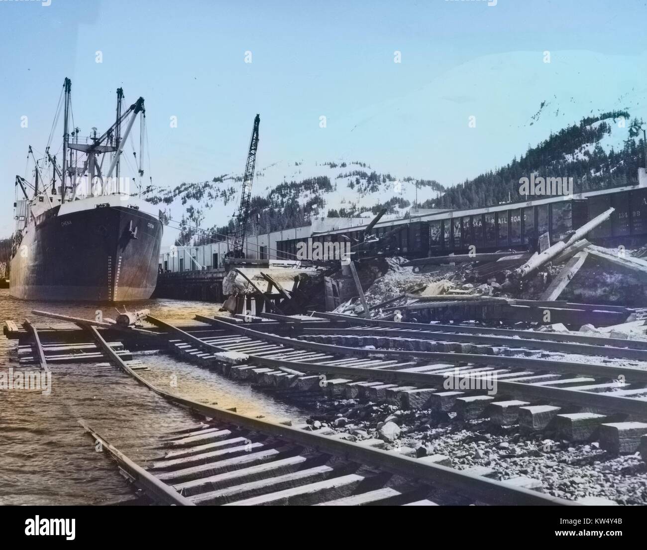 Ships at docks and railroad tracks in the water following an earthquake ...