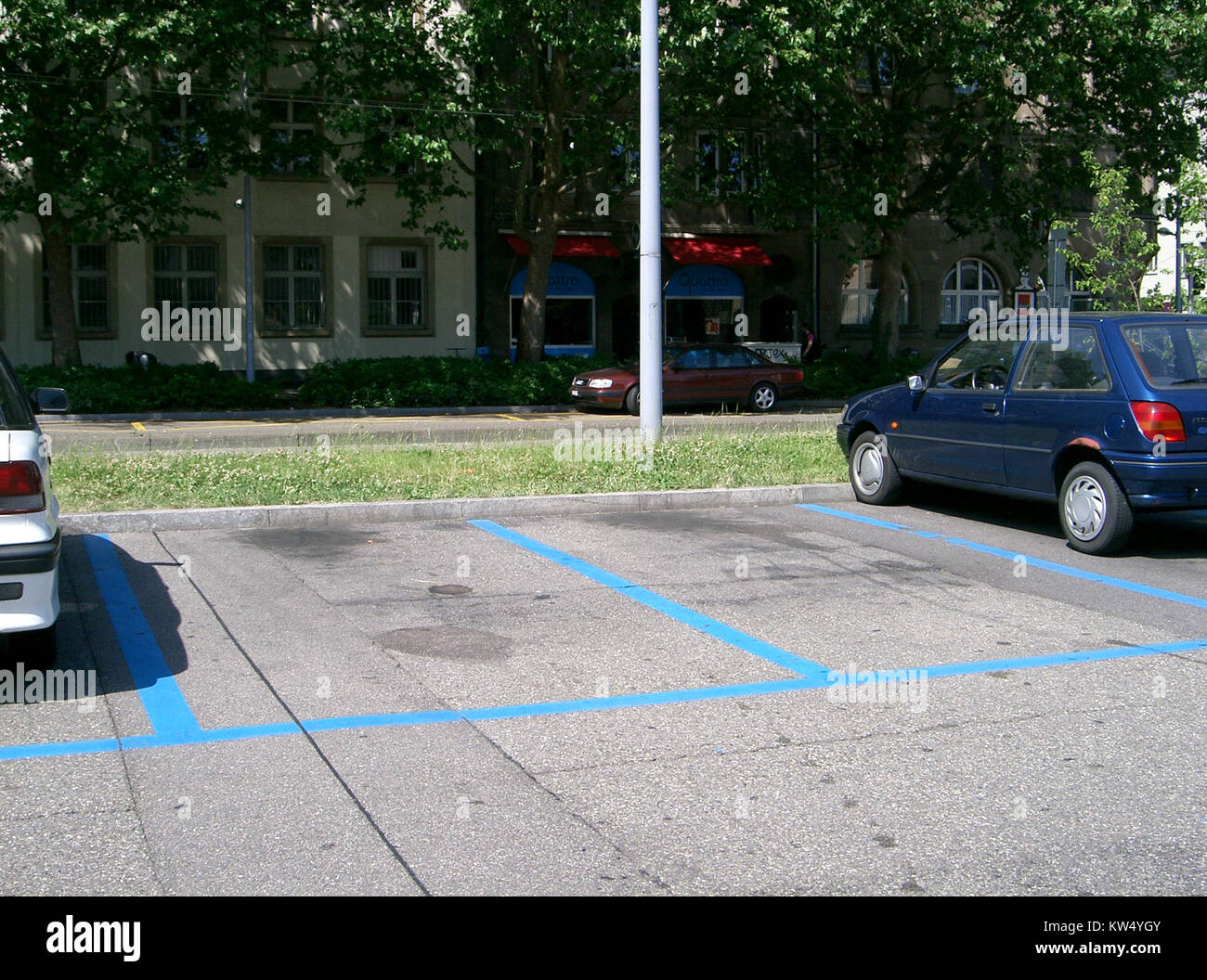 An image showing blue disc parking area markings, often used to ...