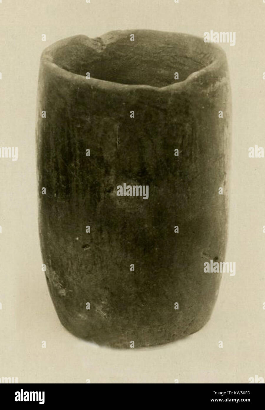 This black-topped red ware cylindrical jar, held in the collection of ...