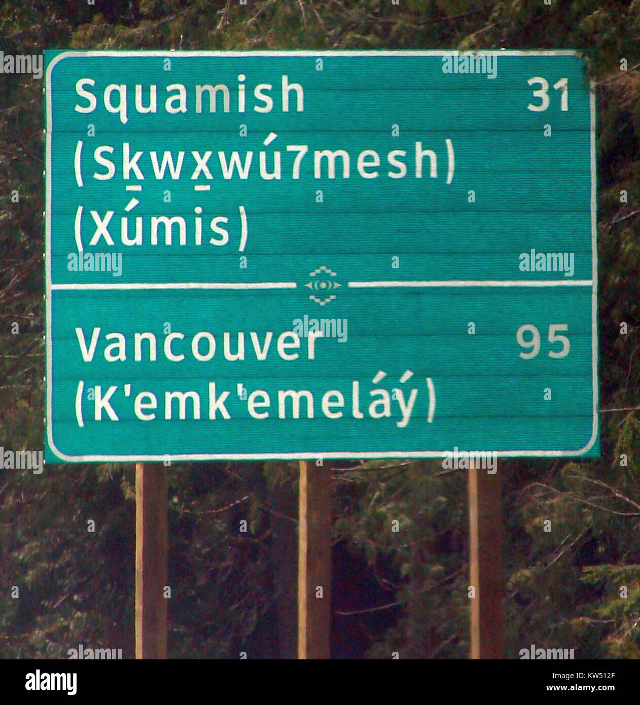 This bilingual road sign, displaying both English and Squamish language ...