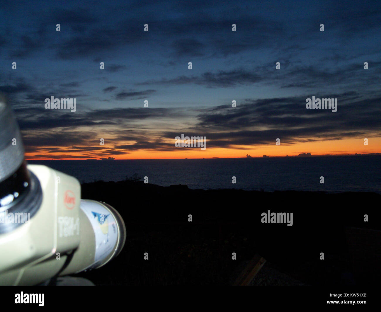A serene birdwatching scene captured at sunrise on the southern cape of ...