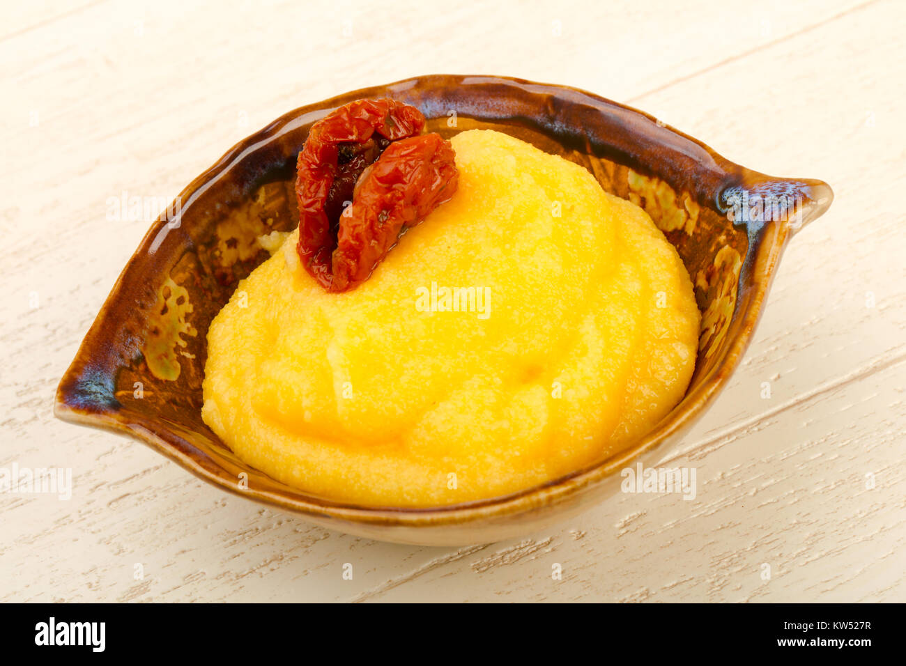 Polenta with dry tomato Stock Photo - Alamy