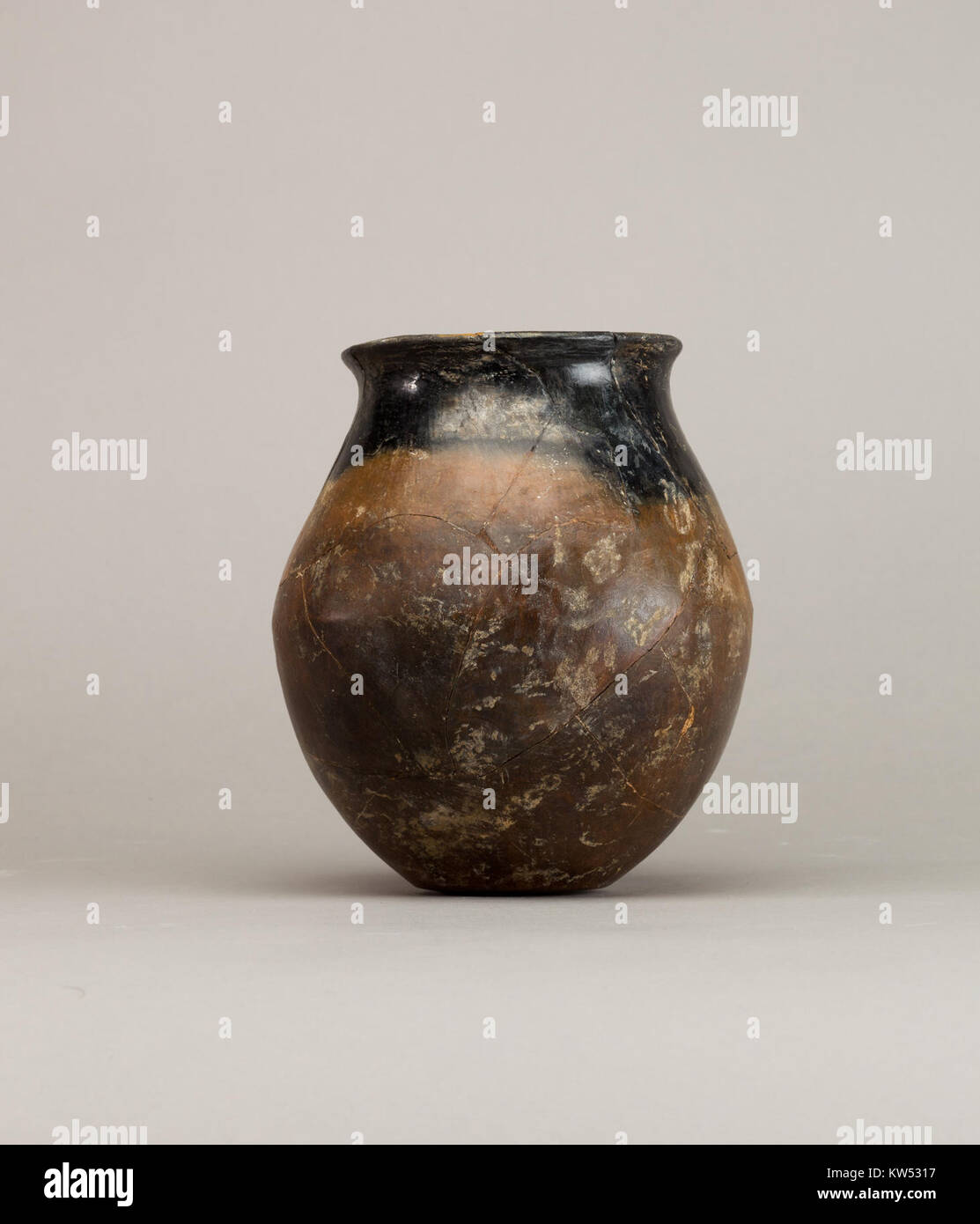 This red ware jar, with a black top, is part of the Metropolitan Museum ...