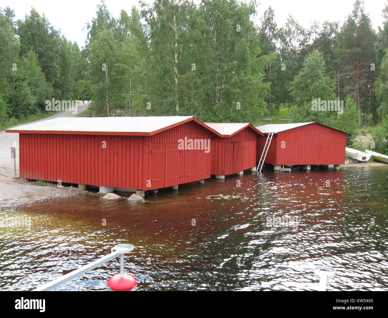A photograph of boat huts at Uukuniemi, Finland, highlighting ...