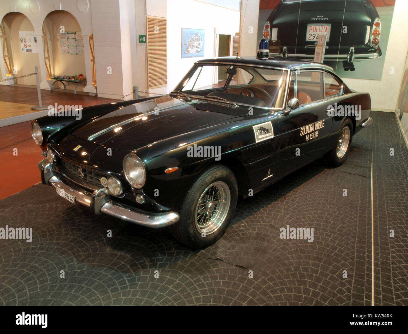 This photograph features a black Ferrari used by the police, a rare ...