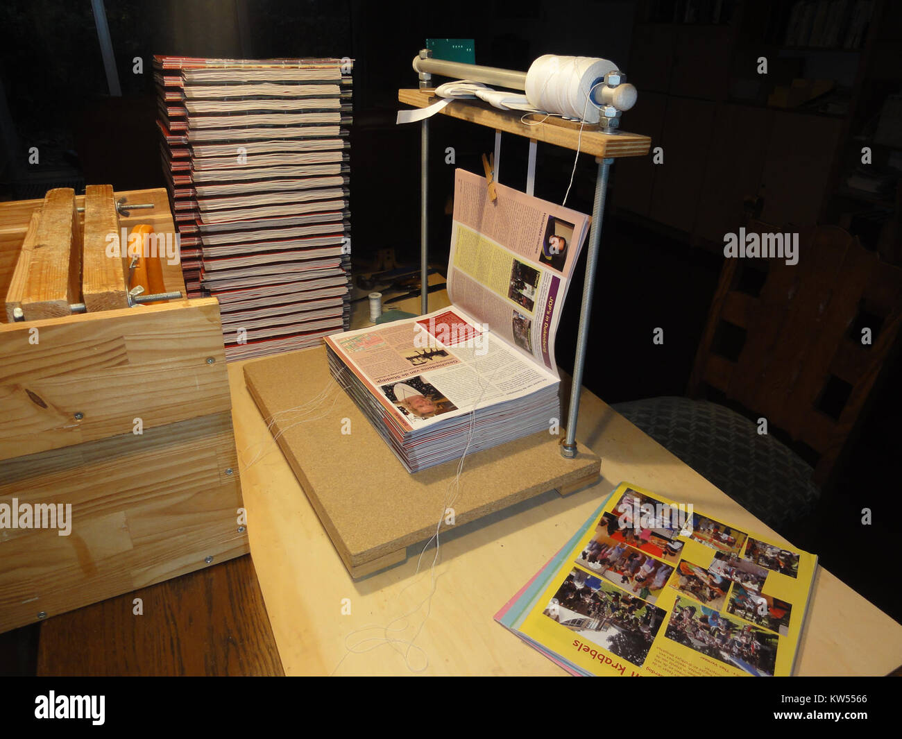 This image shows a bookbinding process from the Dukenburg Bookbinding ...