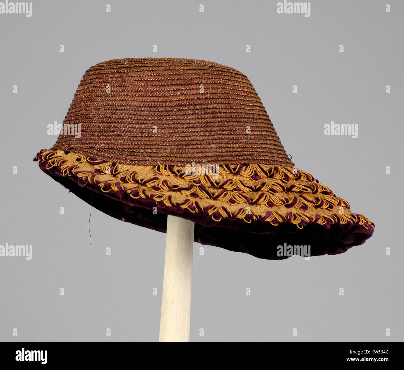 A detailed examination of the bonnet from the MET collection, focusing ...