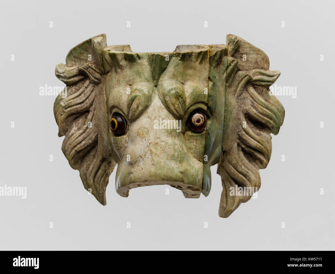 The Bone Lion's Head Protome, featuring glass eyes, is an ancient ...