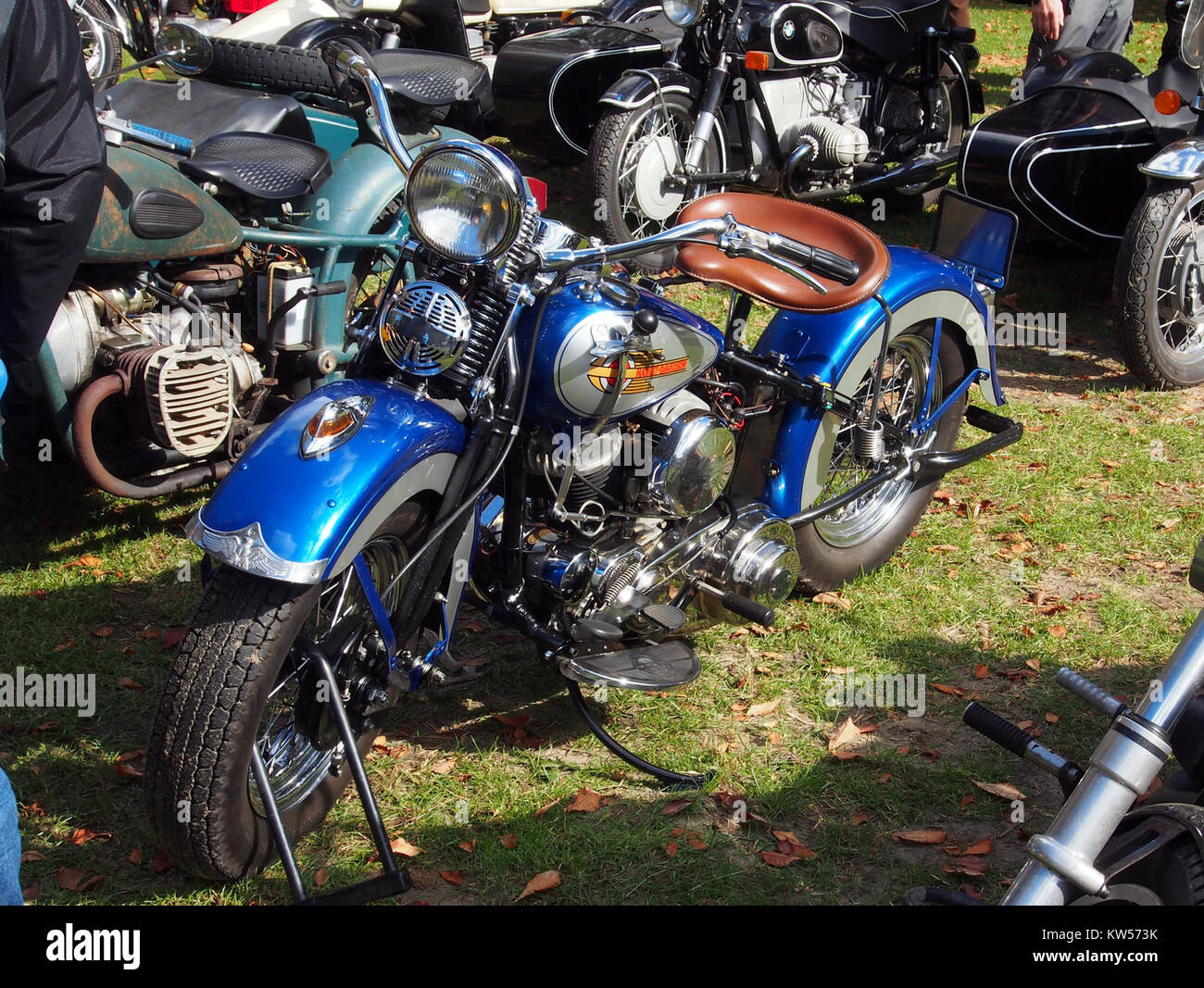 This image showcases a blue Harley Davidson motorcycle, emphasizing the ...