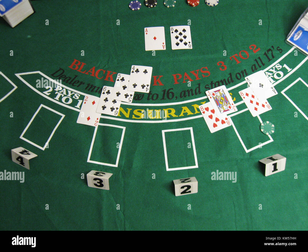 This image shows a Blackjack game setup, a popular card game played in ...