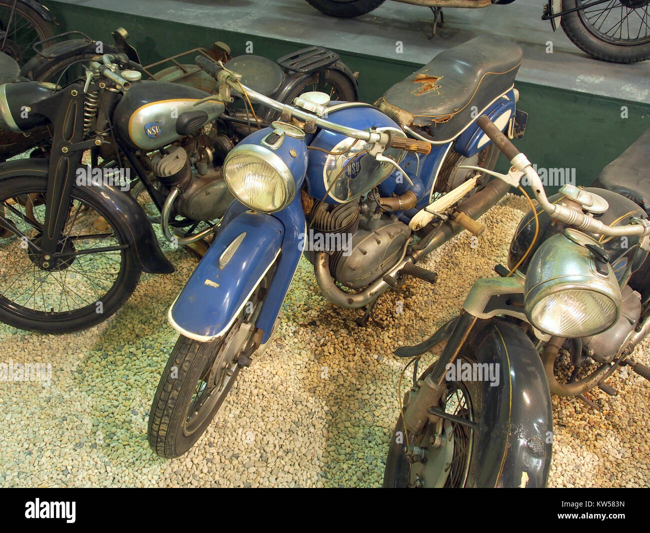 This photograph showcases a blue and silver NSU motorcycle on display ...