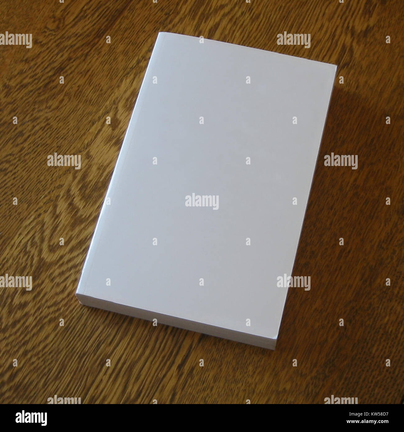 Blank book on a table Stock Photo - Alamy