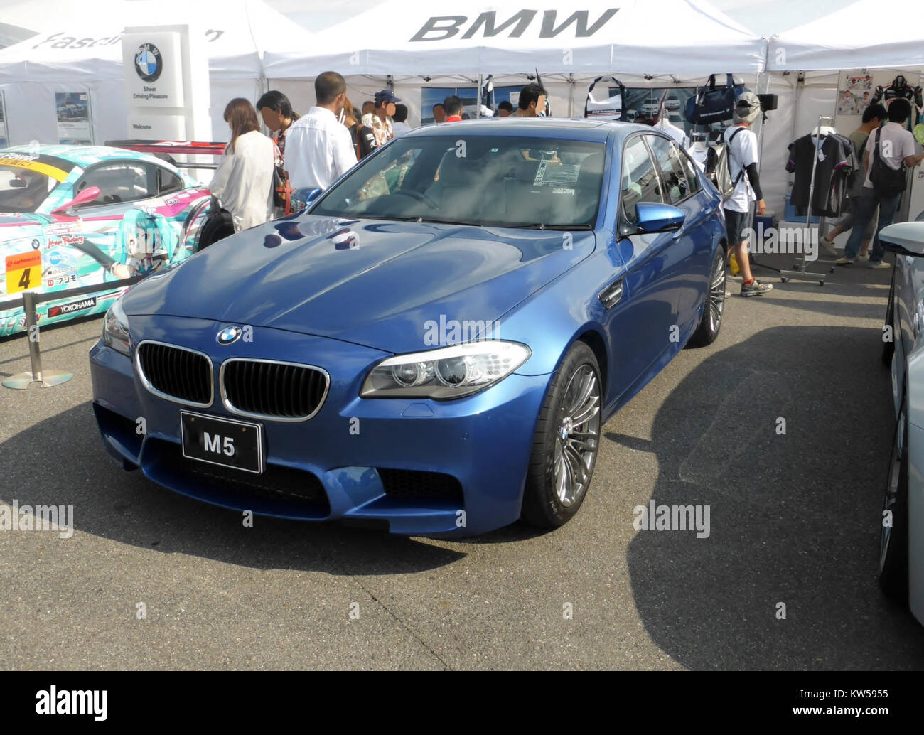 This image shows the front view of a BMW M5 (F10), a high-performance ...