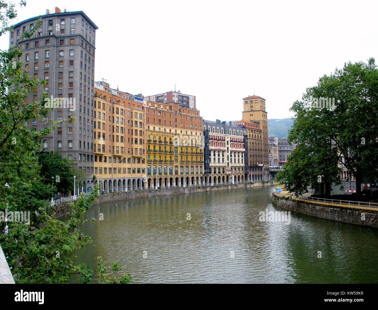 A photograph of the Bilbao ria in Spain, capturing the riverside views ...