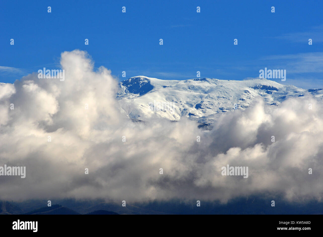 clouds and mountains with snow Stock Photo - Alamy