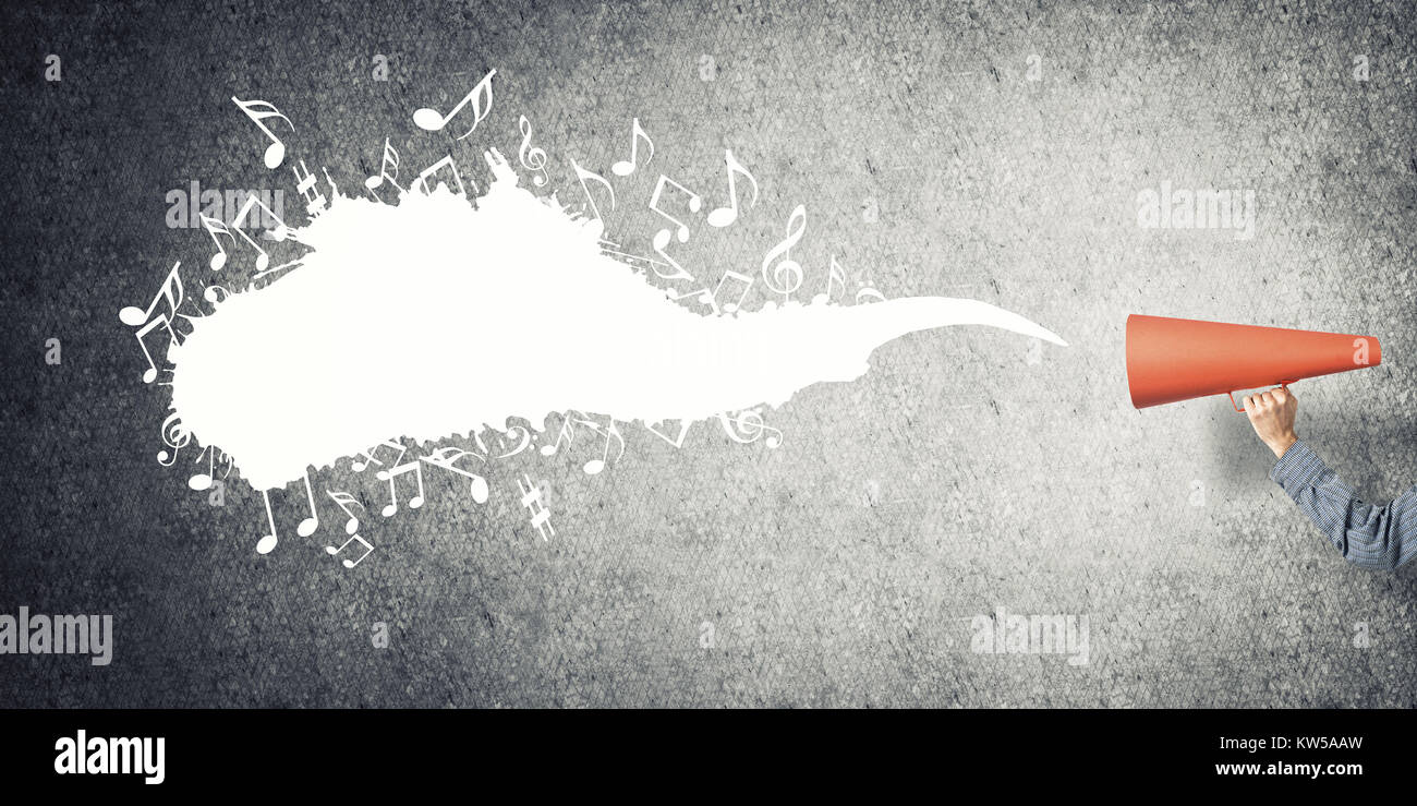 Close of man making announcement in paper trumpet Stock Photo - Alamy