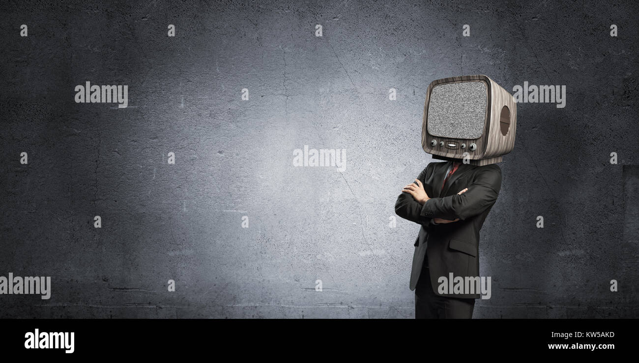 Businessman in suit with old TV instead of head keeping arms crossed ...