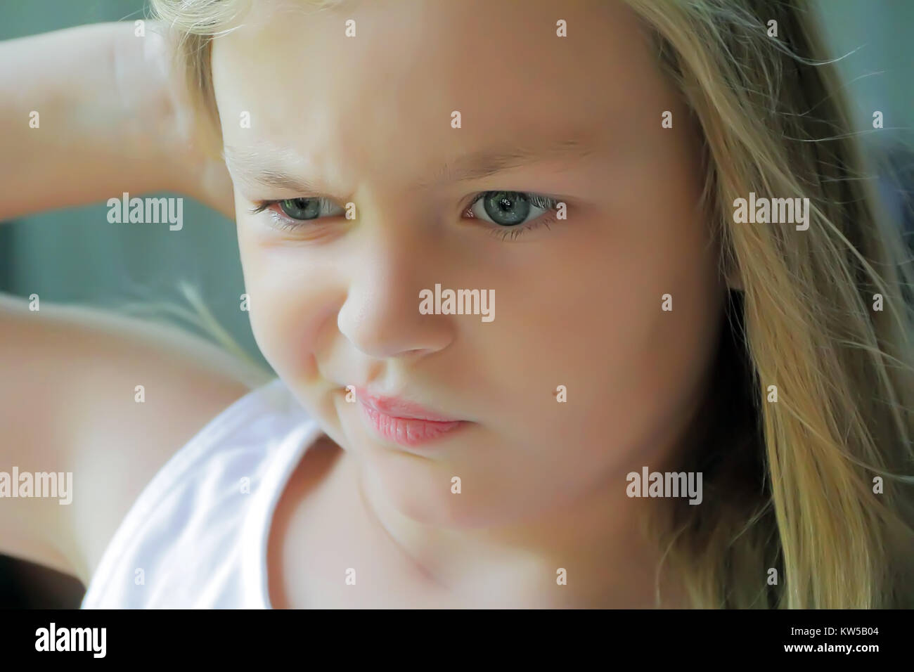 Portrait of beautiful thinking girl with blue eyes Stock Photo - Alamy