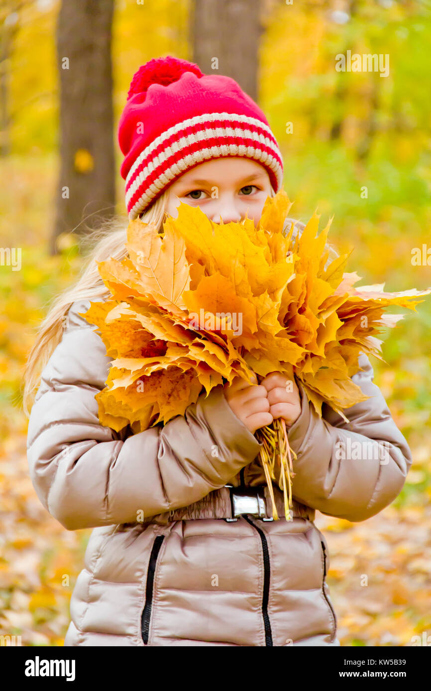 Photo of cute smiling girl in autumn Stock Photo - Alamy