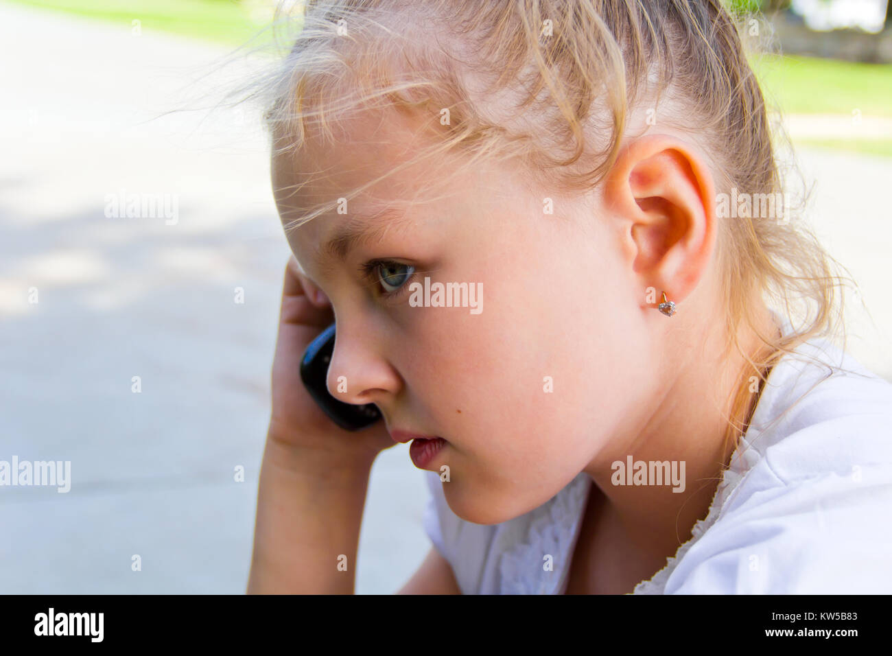 Photo of cute girl talking by cellular Stock Photo - Alamy