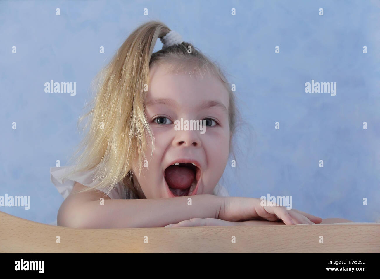 Portrait of girl with smile and open mouth Stock Photo - Alamy