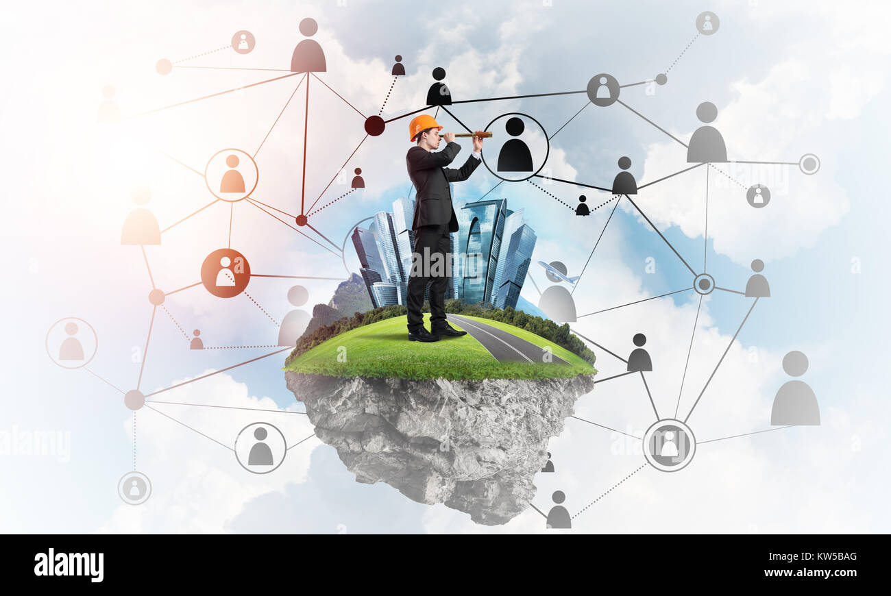 Engineer man on flying green island floating in blue sky Stock Photo ...
