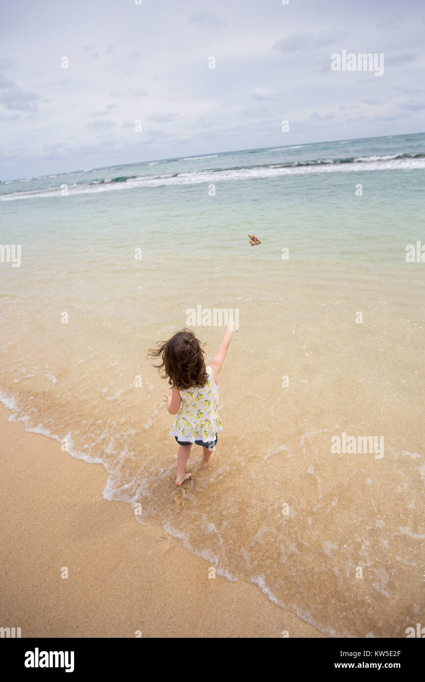 Children girl throwing rocks hi-res stock photography and images - Alamy