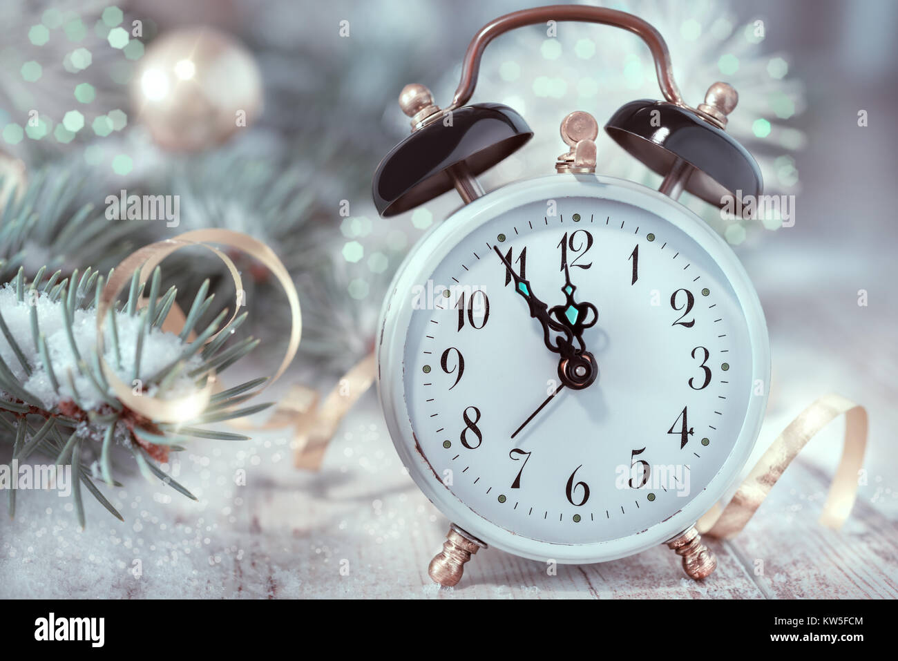 Old alarm clock showing five to midnight. Happy New Year! Stock Photo ...