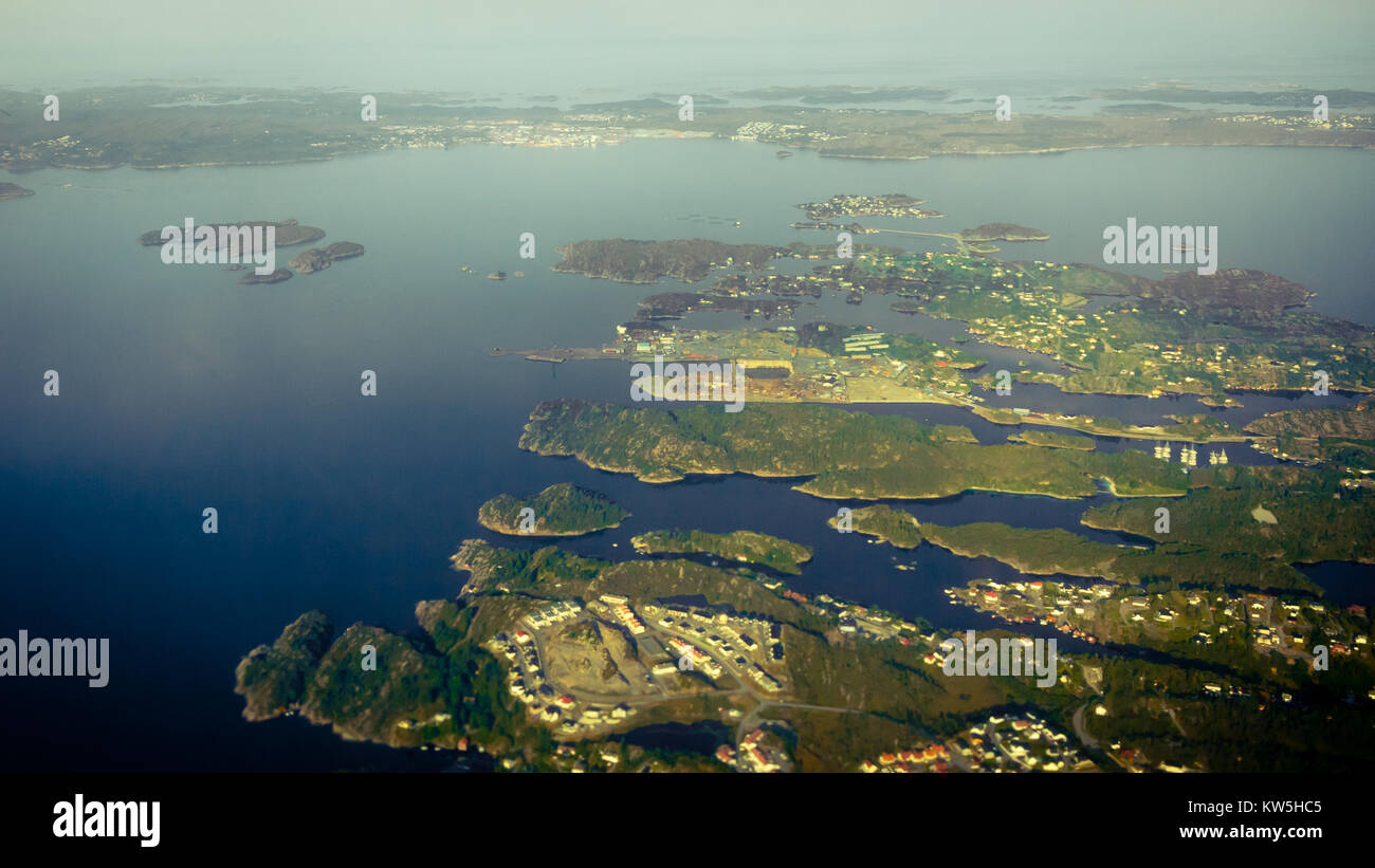 Birds eye. View from window of plane airplane flying over fjords Norway ...