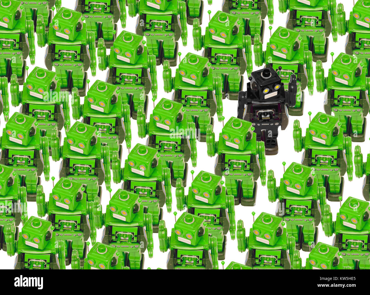 concept gong against the crowed with retro robot toys Stock Photo - Alamy