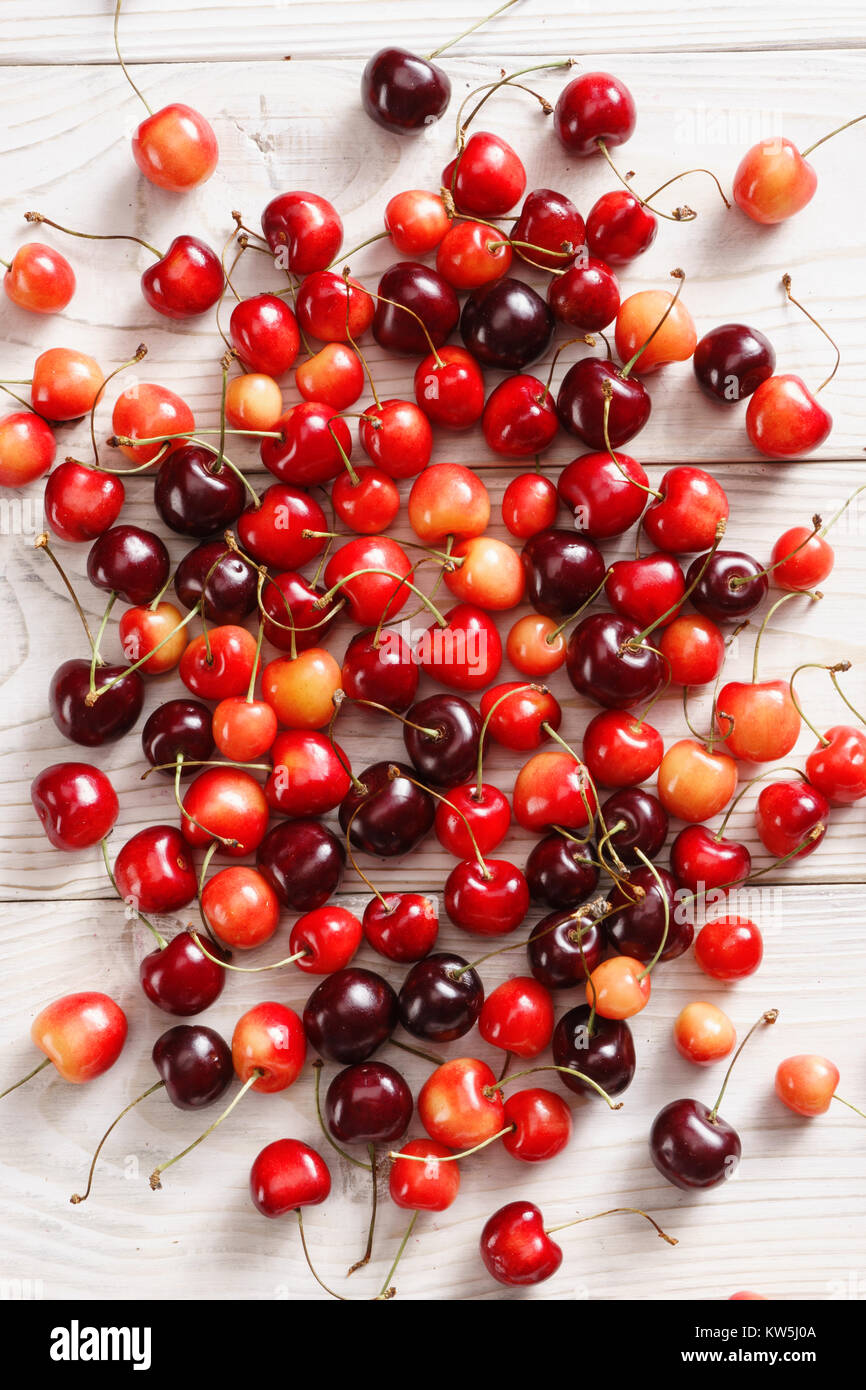 Cherry on white wooden table. Top view. High resolution product Stock ...