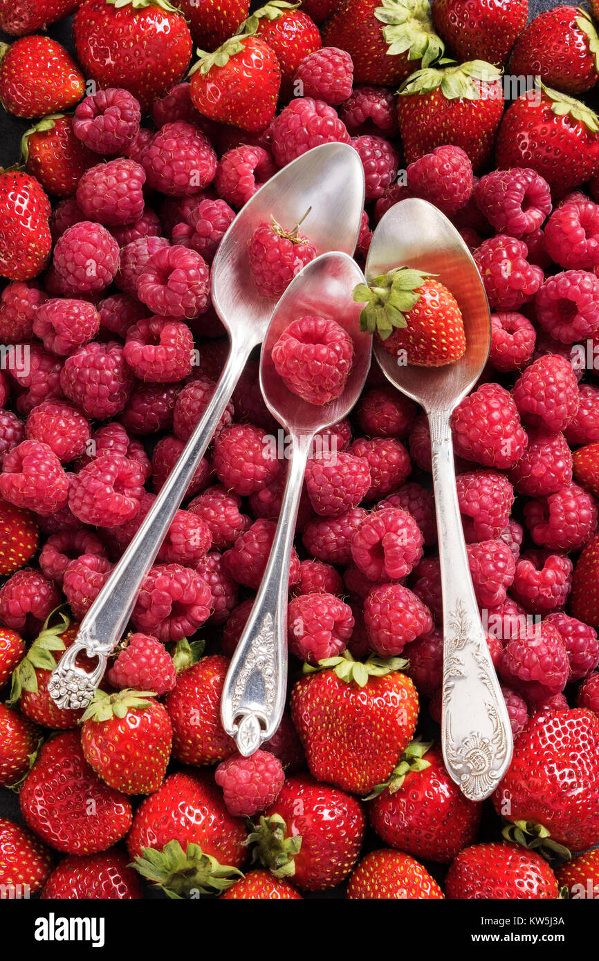 Strawberry and raspberry background. Top view. Close up. High ...