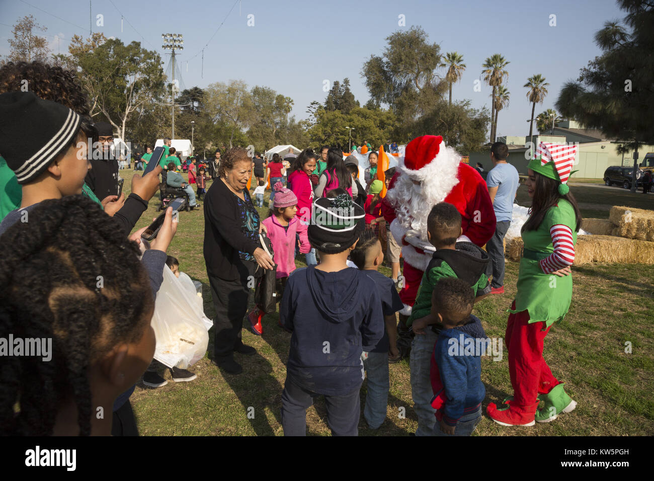 Santa Clause poses with children at Snow Day at Drake Park in Long ...