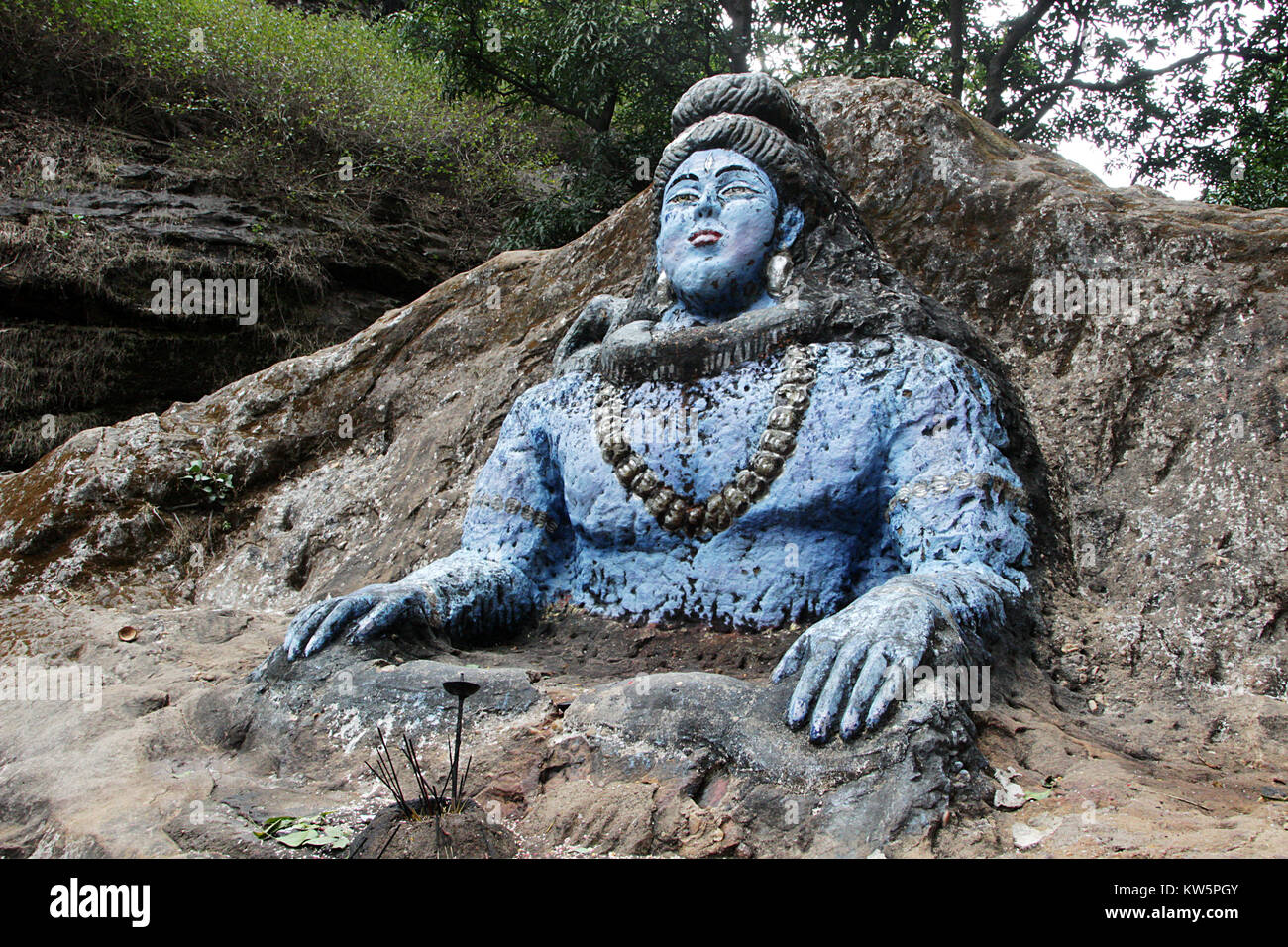 Rock-cut and blue painted carving of Shiva, also known as Jata Shankar ...