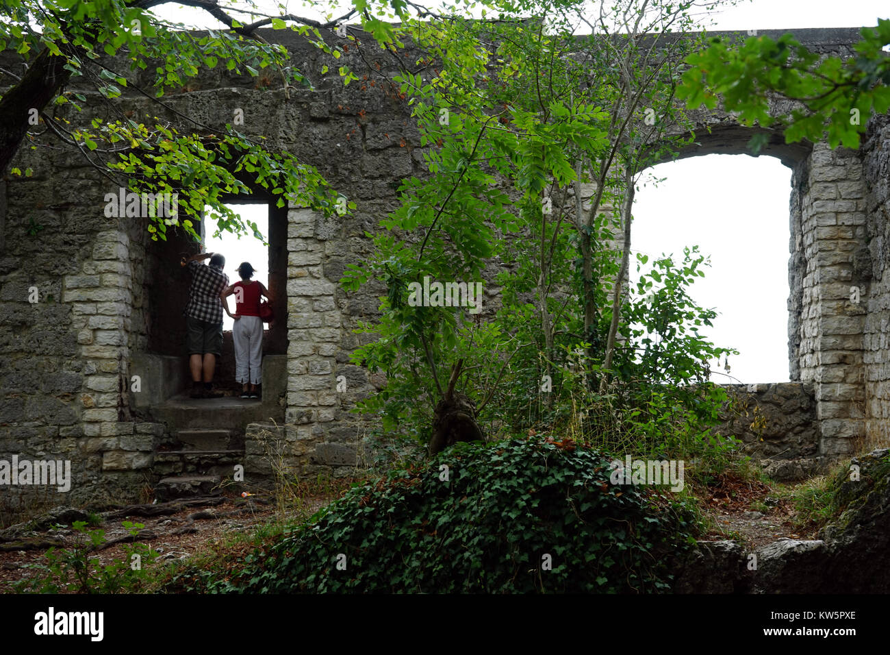 HEUBACH, GERMANY - CIRCA AUGUST 2015 Tourists standing in window of ...