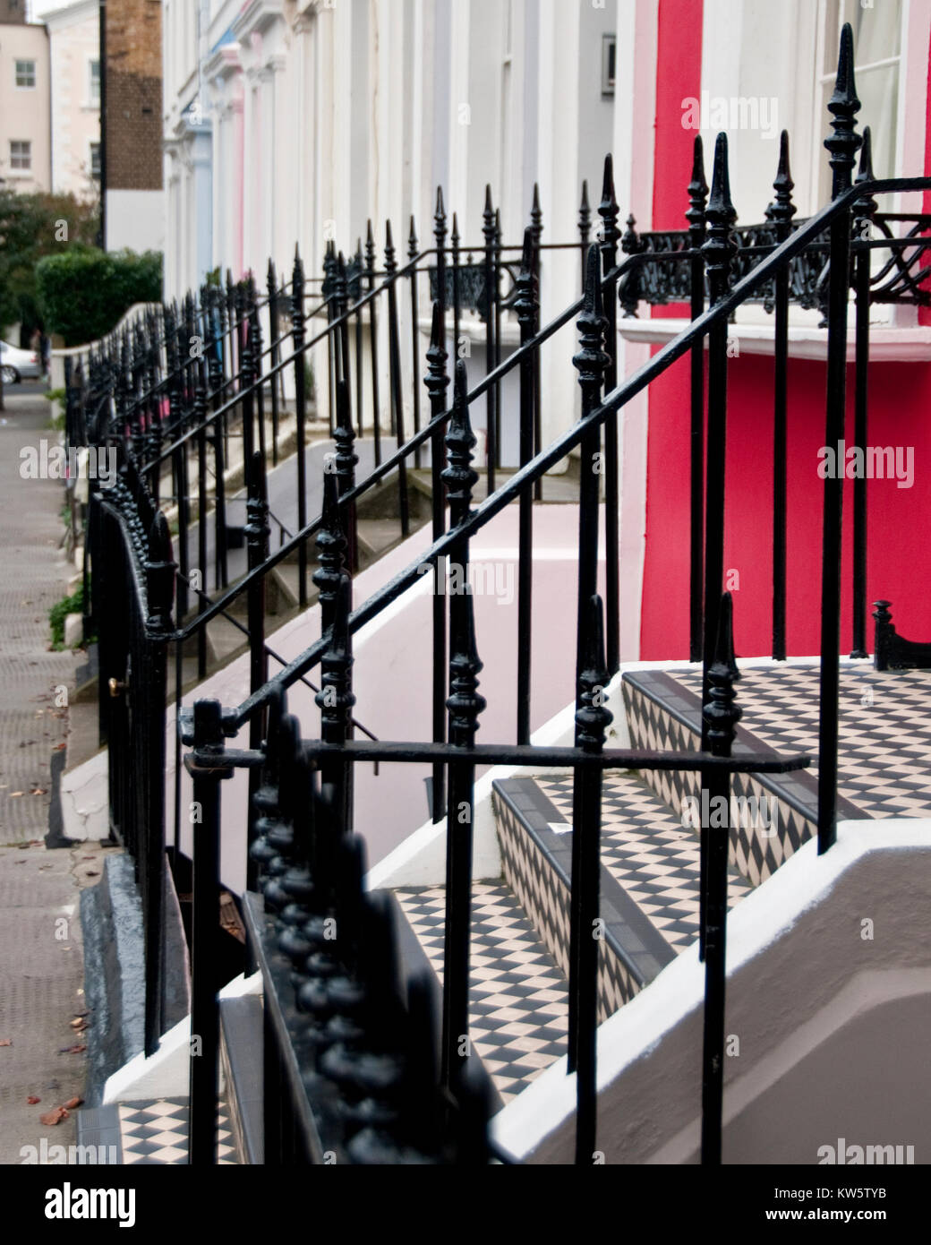 Old Iron Railings in front of colourful houses in Notting Hill, London ...