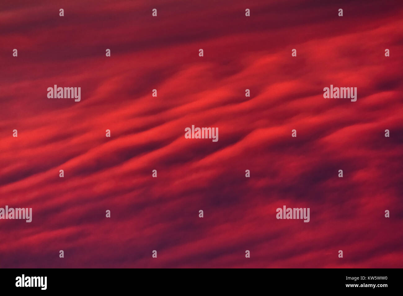 Beautiful red clouds, waves in the sky Stock Photo - Alamy