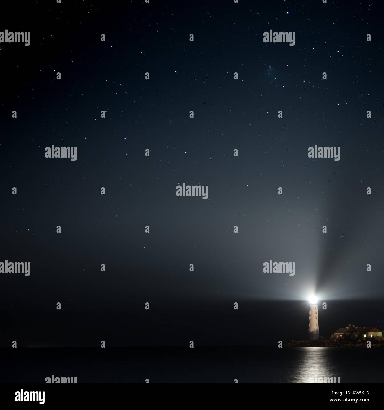 beacon light and starry sky Stock Photo - Alamy