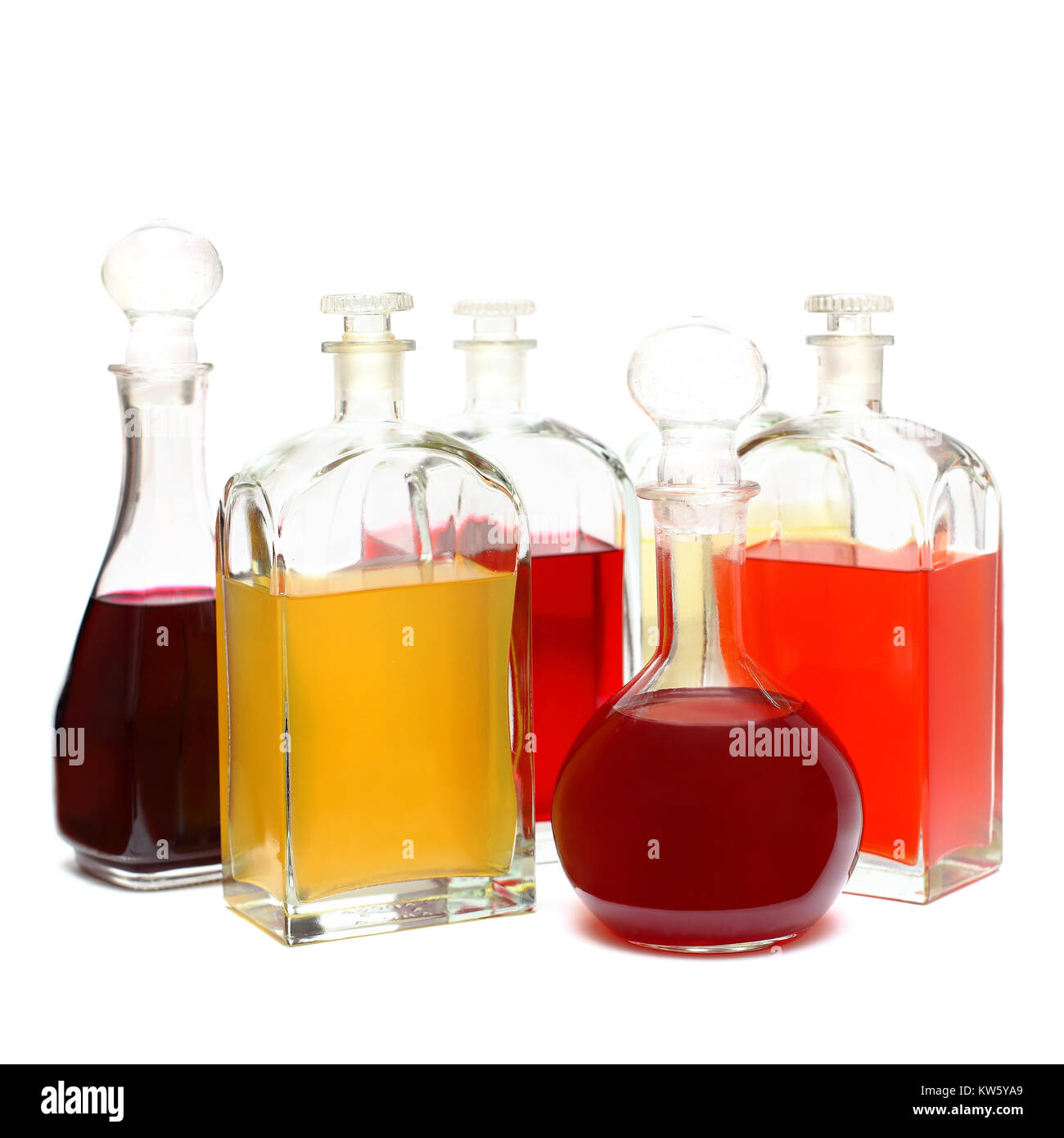 Alcohol bottle - glasses with color liqueur Stock Photo - Alamy