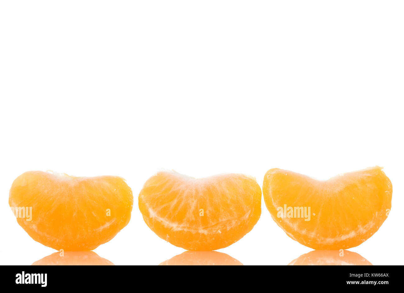 Slice sections of ripe tangerine isolated over the white background ...
