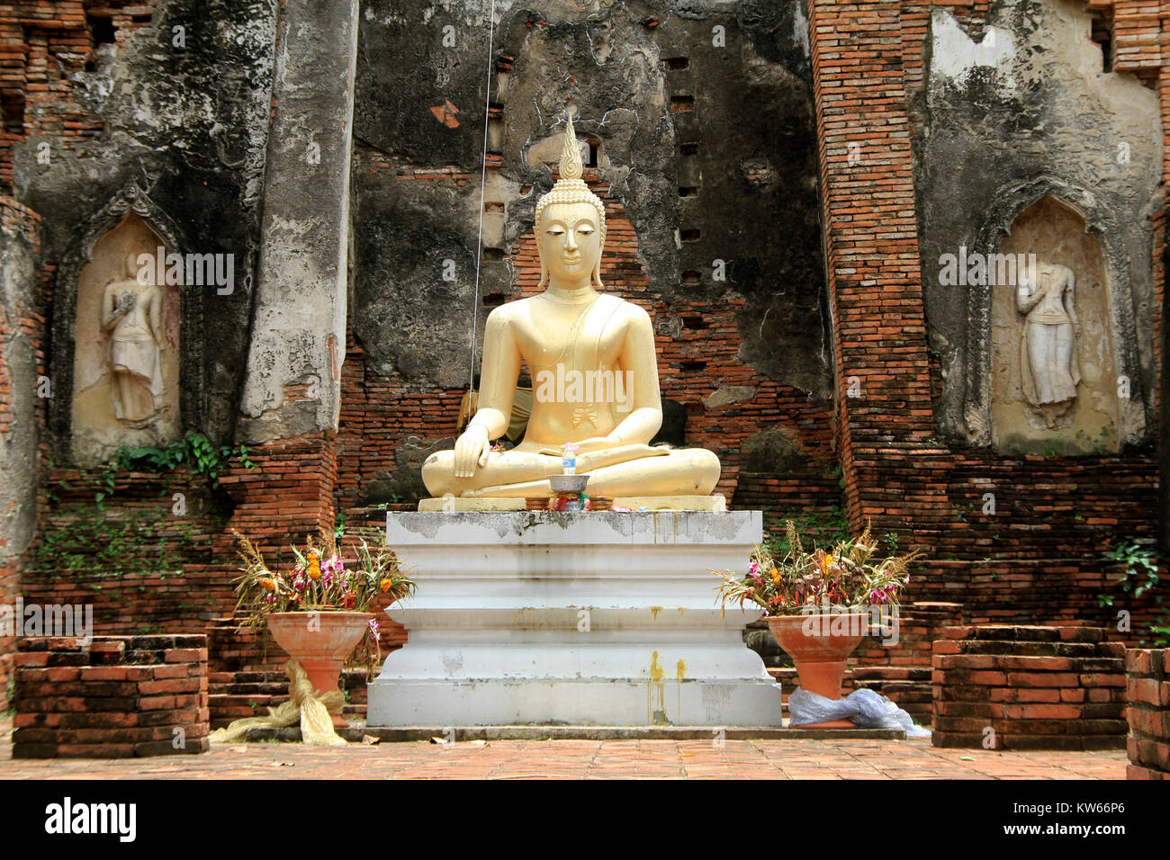 Brick wall and Buddha in WAt Choeng Tha in Ayutthaya in Thailand Stock ...