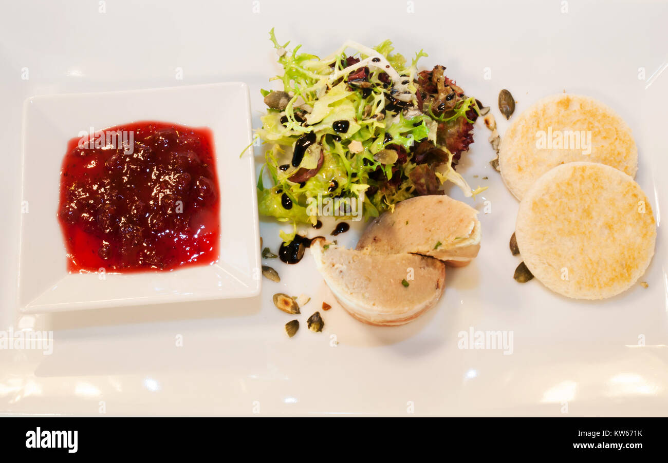 Home made rabbit pate with crispy toast and cranberry sauce Stock Photo ...