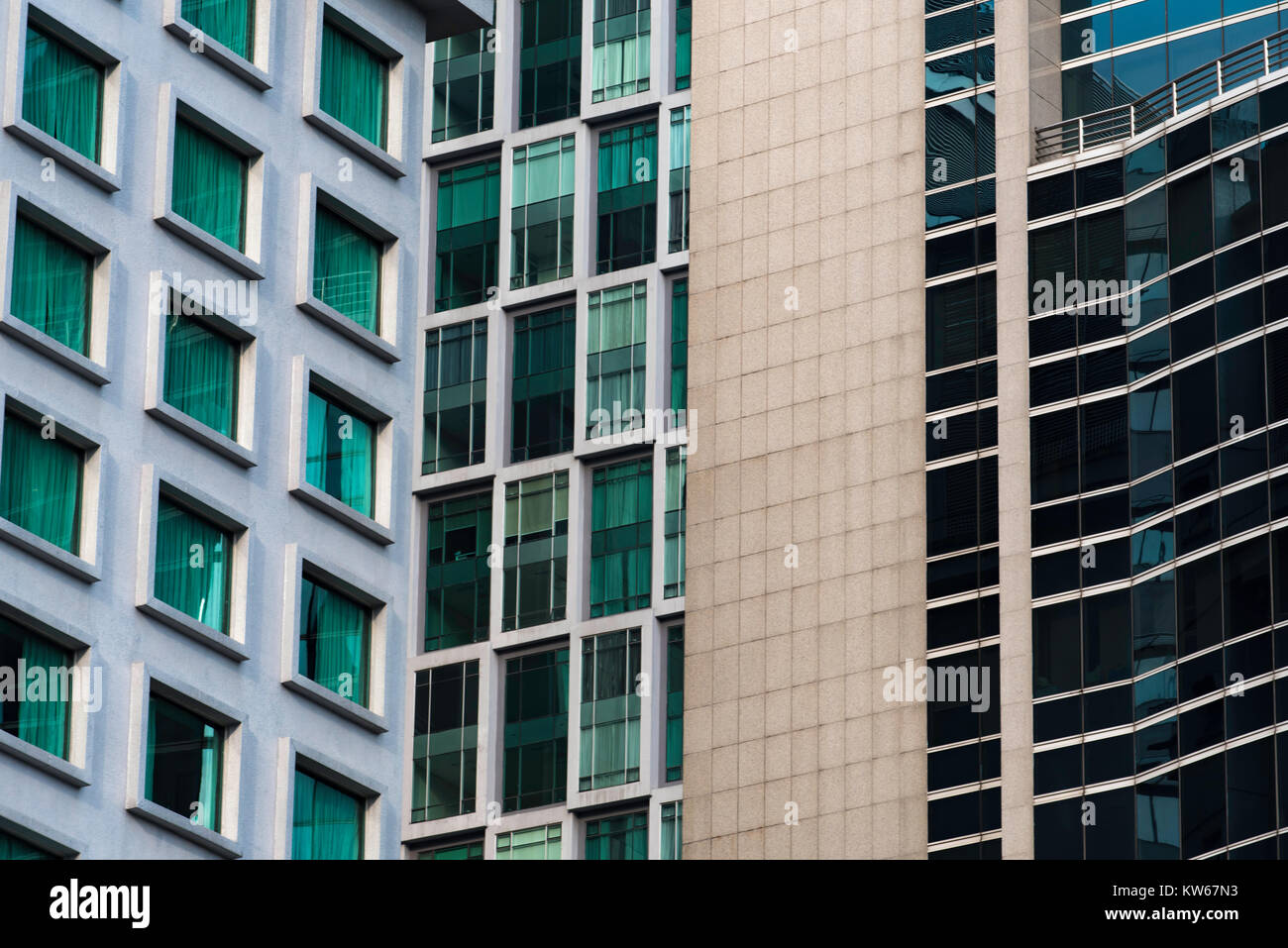 three different high rise towers built very close together in Kuala ...