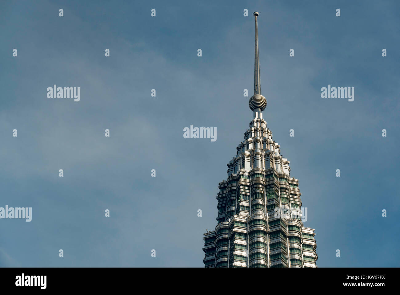 The top of one of the very tall twin Petronas Towers in Kuala Lumpur ...