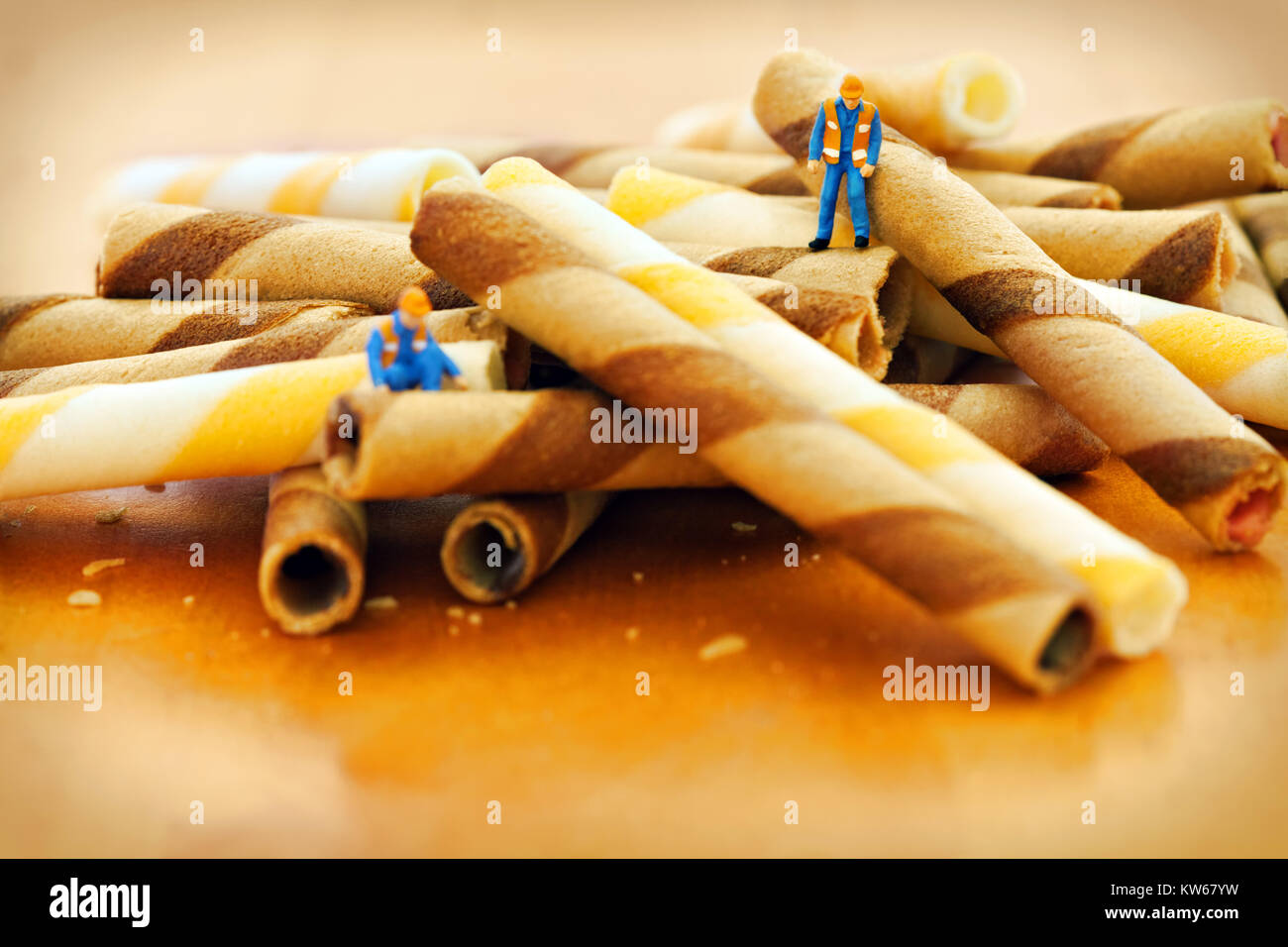 conceptual workers working between wafer tube sticks Stock Photo - Alamy