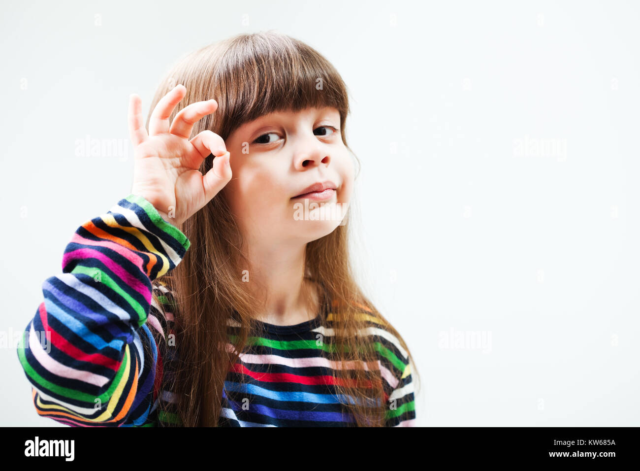 Little girl showing ok sign Stock Photo - Alamy