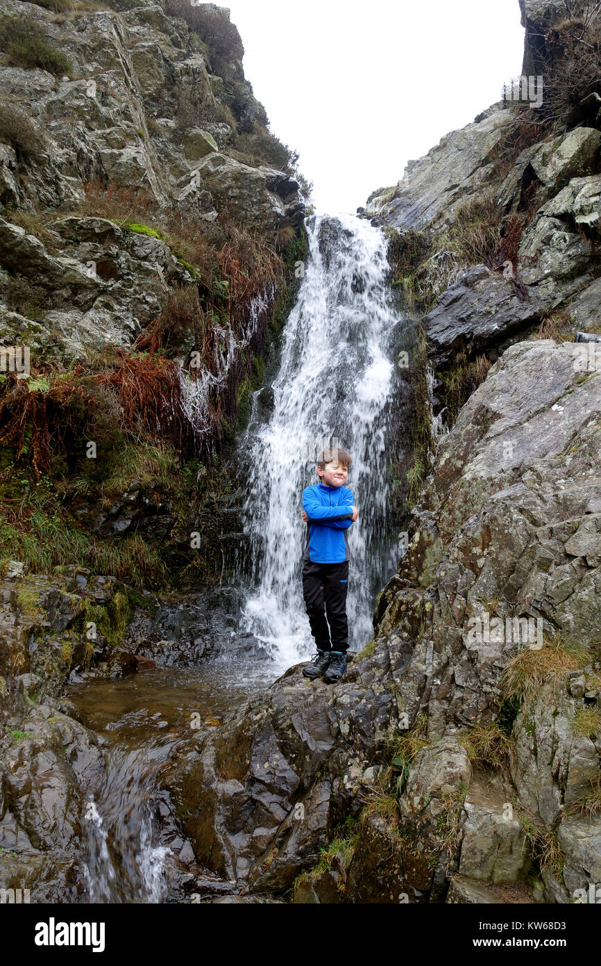 Young boy child walking near waterfall on the Long Mynd hill in ...