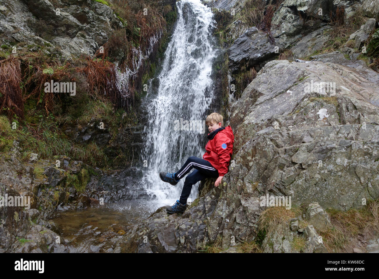 Young boy child walking near waterfall on the Long Mynd hill in ...